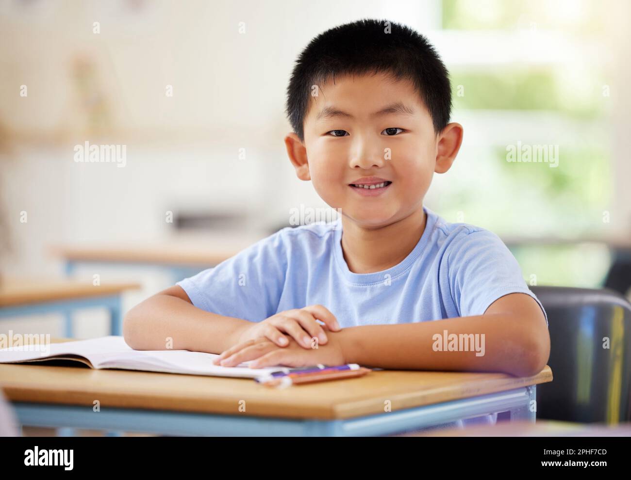 Learning, portrait and Asian boy in classroom for education, exam or ...
