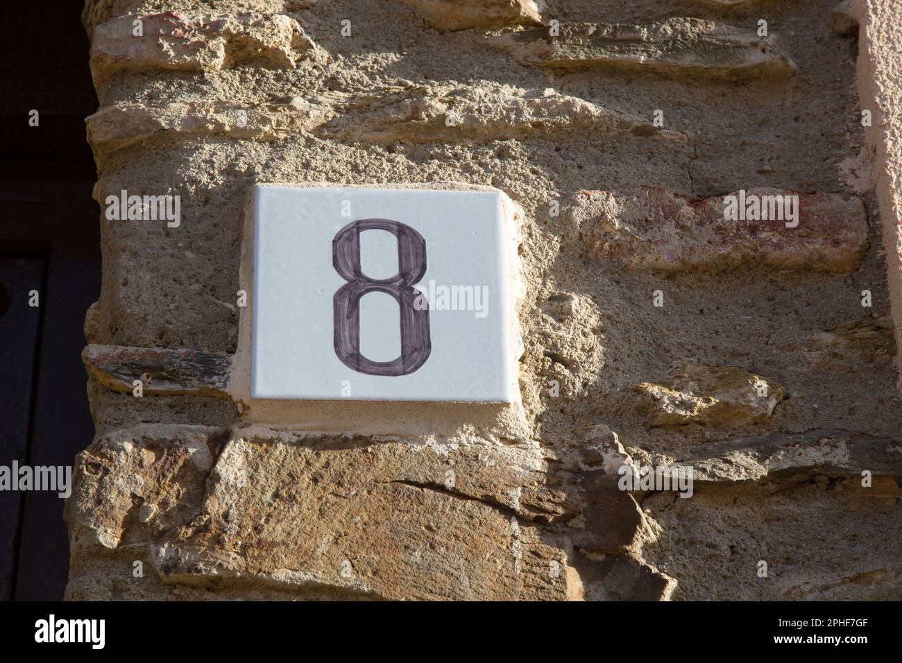 Number Eight on Building Facade Stock Photo - Alamy