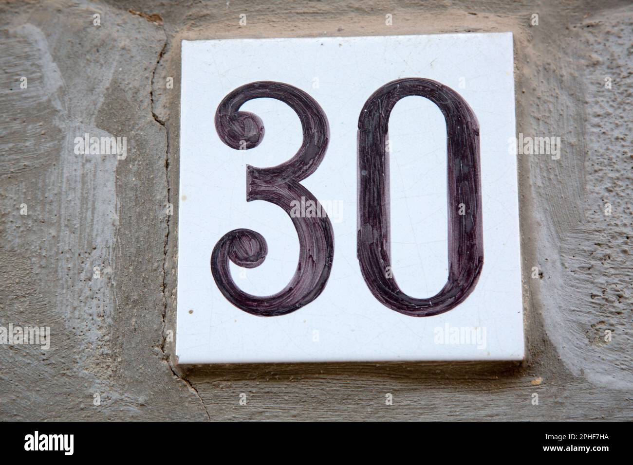 Number Thirty on Building Facade Stock Photo - Alamy