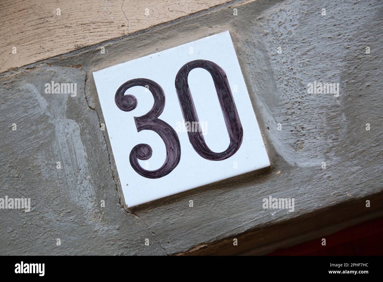 Number Thirty on Building Facade Stock Photo - Alamy