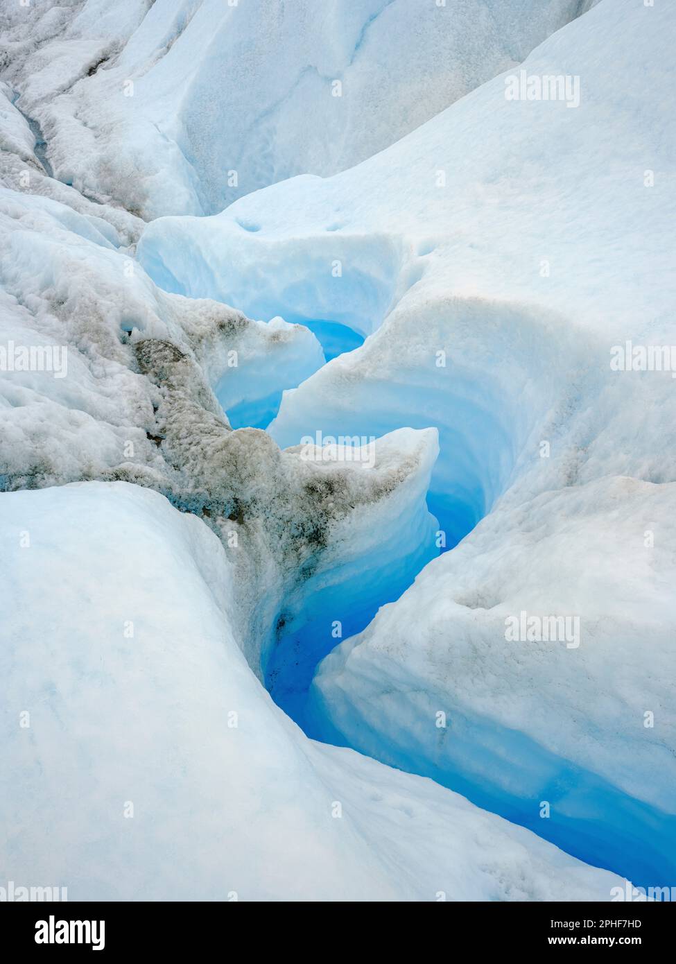 Drainage system on the surface of the ice sheet. The brown sediment on ...