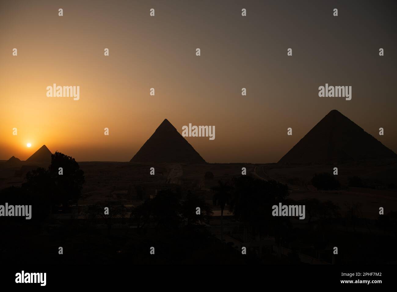 A view of the Pyramids of Giza at sunset in Egypt Stock Photo - Alamy