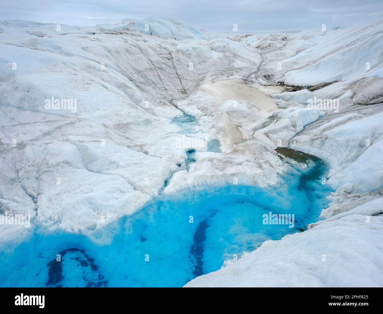 Drainage system with lake on the surface of the ice sheet. The brown ...