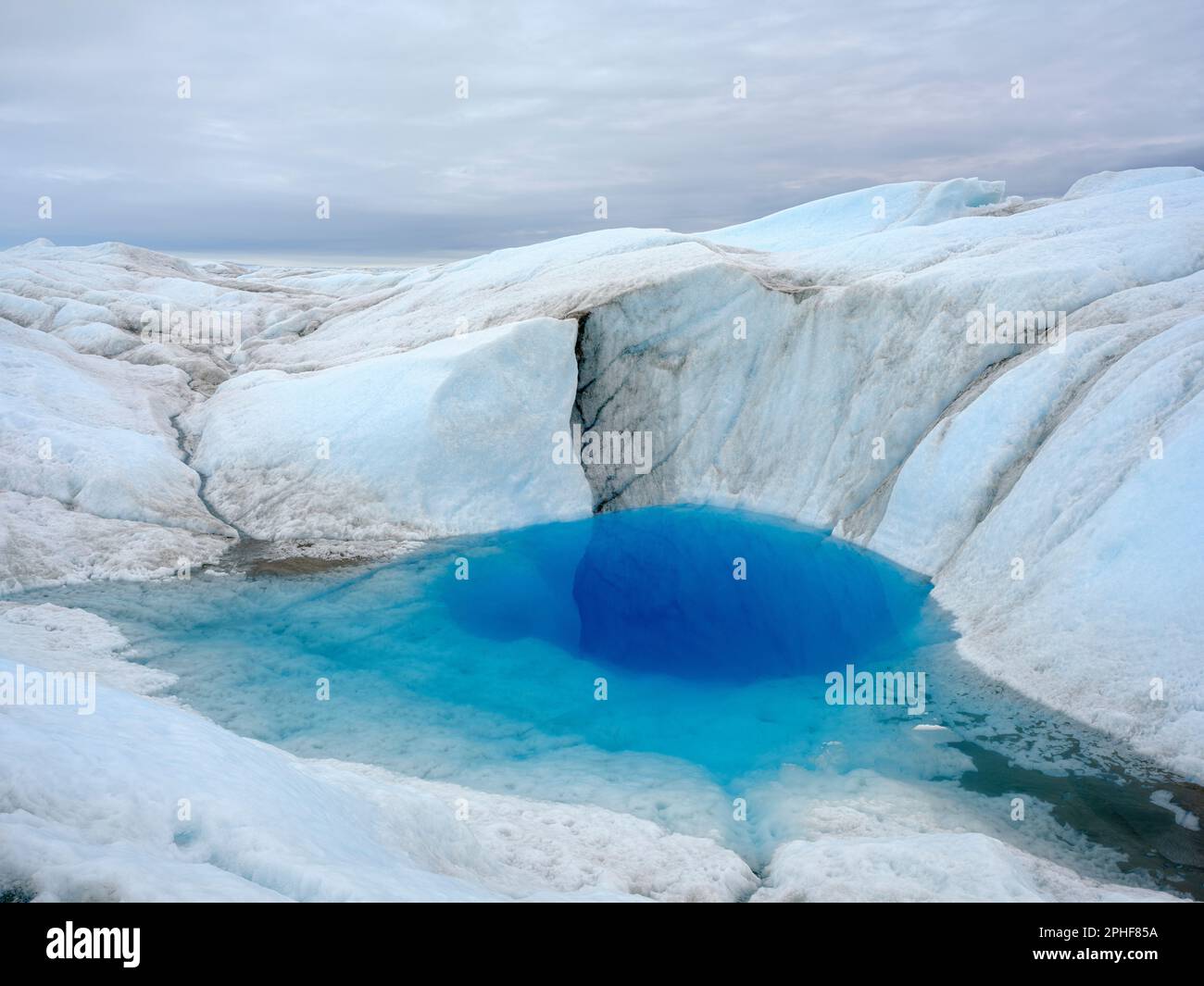 Drainage system with lake on the surface of the ice sheet. The brown ...