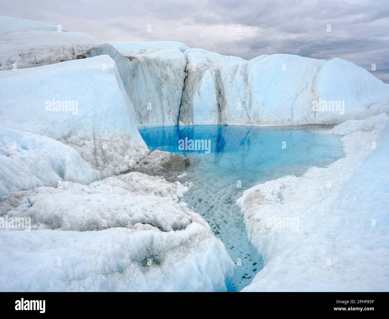 Drainage system with lake on the surface of the ice sheet. The brown ...