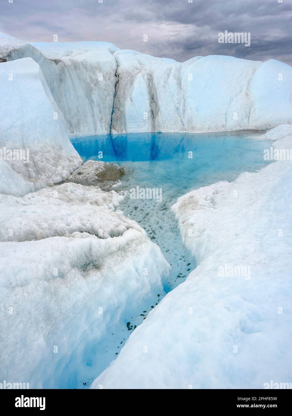 Drainage system with lake on the surface of the ice sheet. The brown ...
