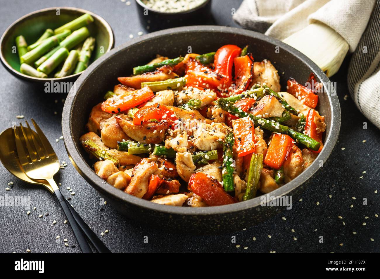 Chicken stir fry with vegetables at stone background Stock Photo - Alamy