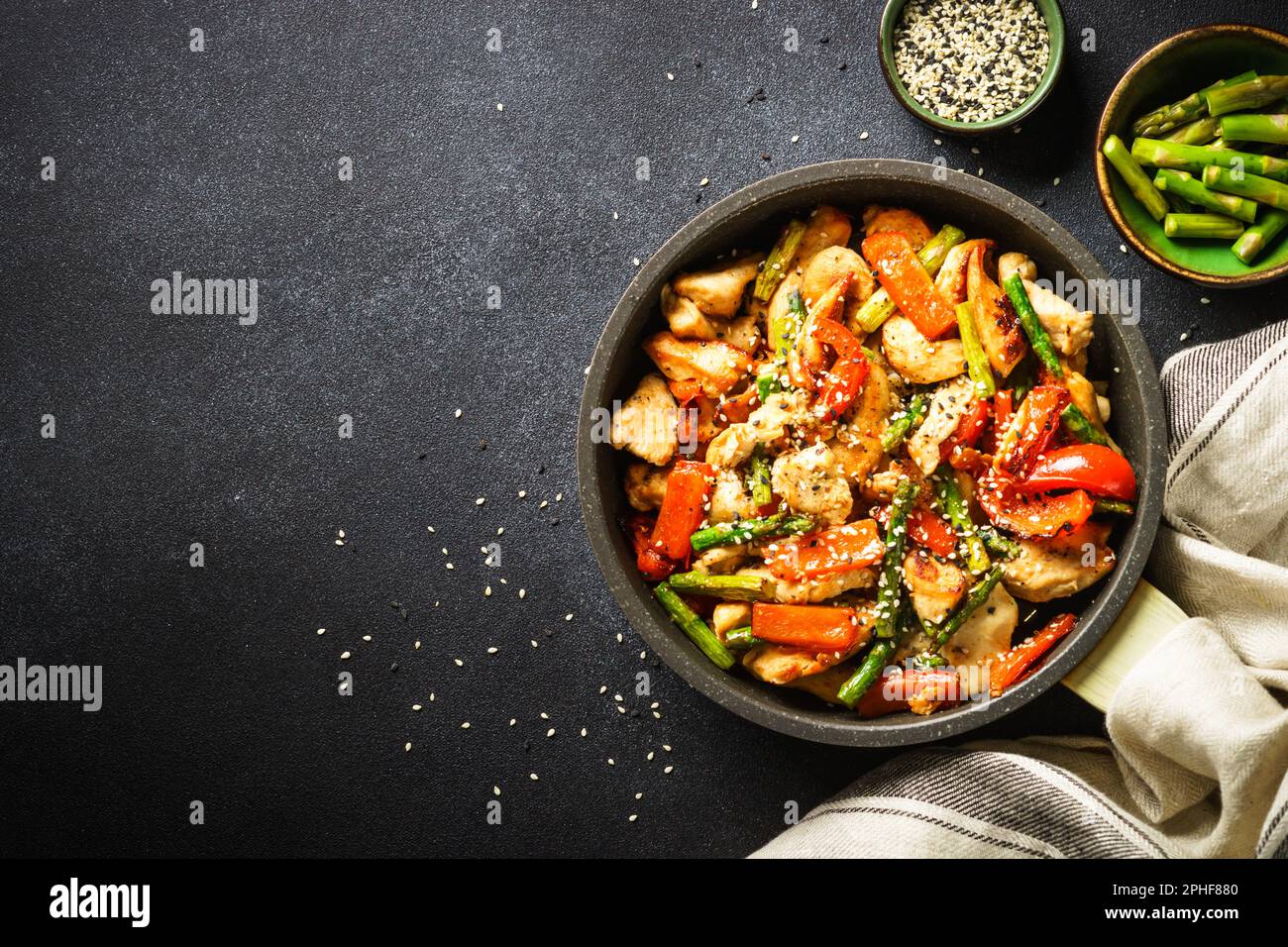 Chicken stir fry with vegetables at stone background Stock Photo - Alamy