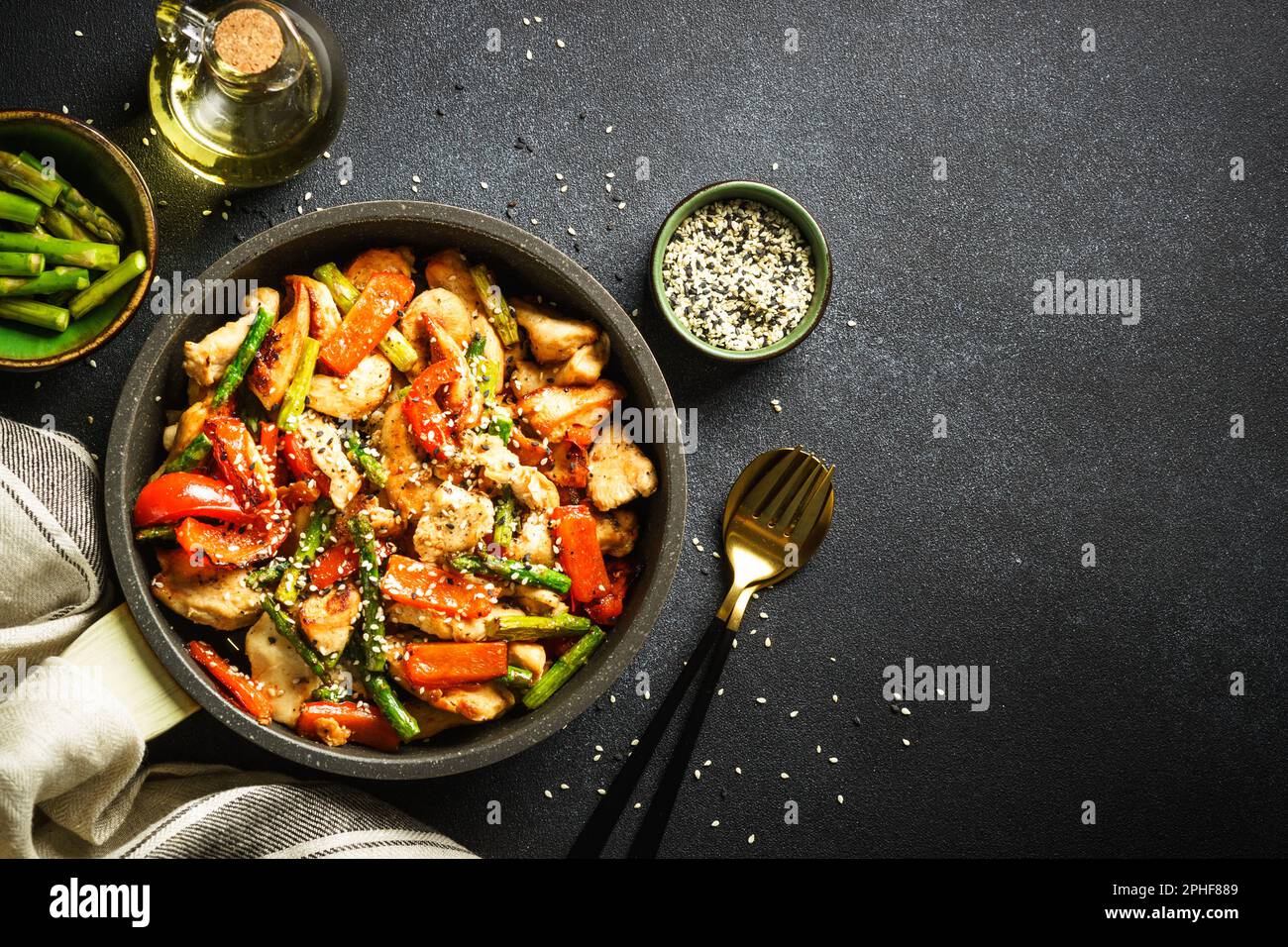 Chicken stir fry with vegetables at stone background Stock Photo - Alamy