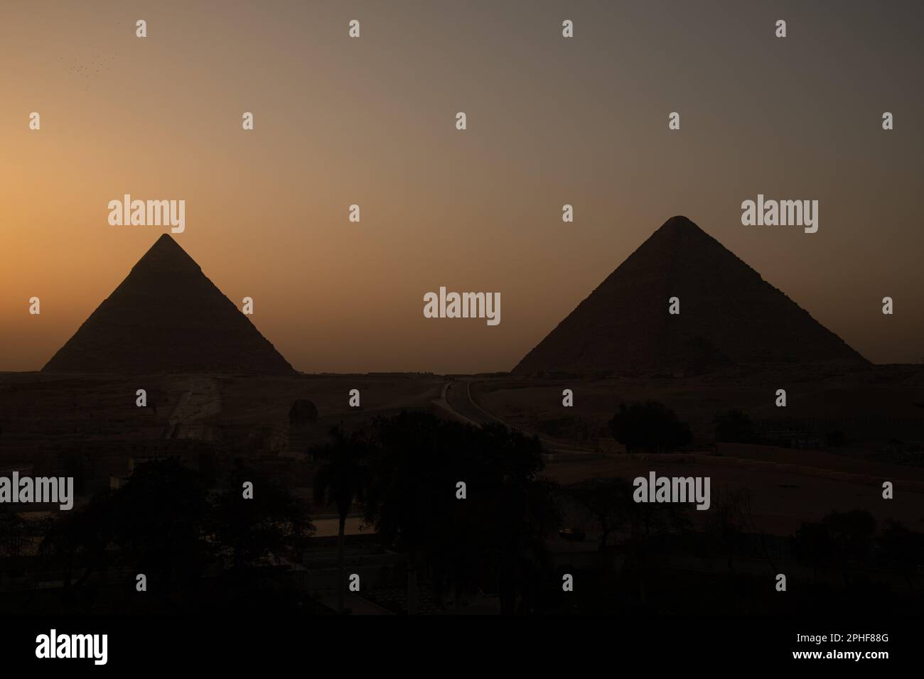A view of the Pyramids of Giza at sunset in Egypt Stock Photo - Alamy