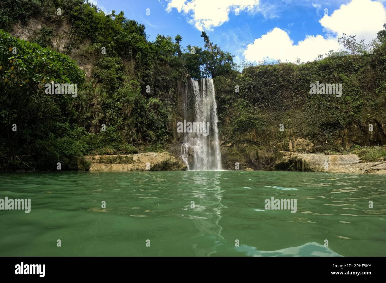 The idyllic Camugao Waterfall in Siquijor in the Philippines that flow ...