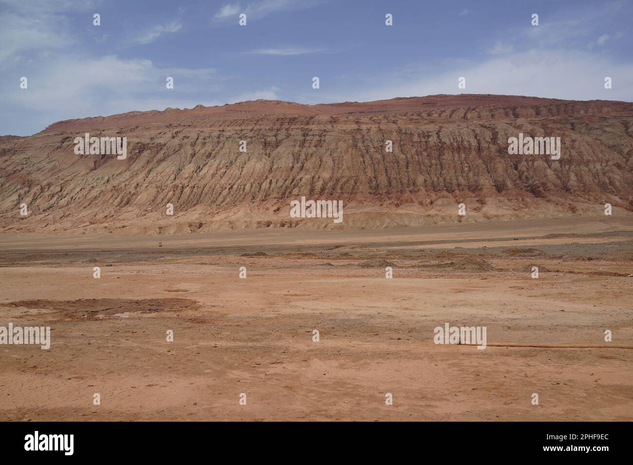 A massive rock formation in an arid area. Northern Xinjiang, China ...