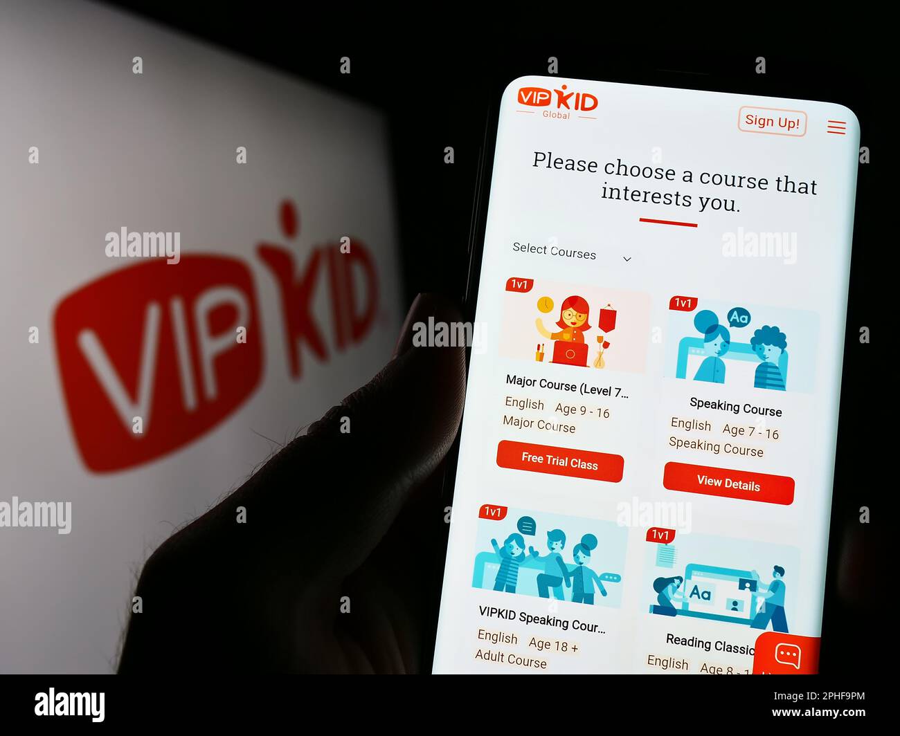 Person holding smartphone with web page of e-learning company VIPKid on ...