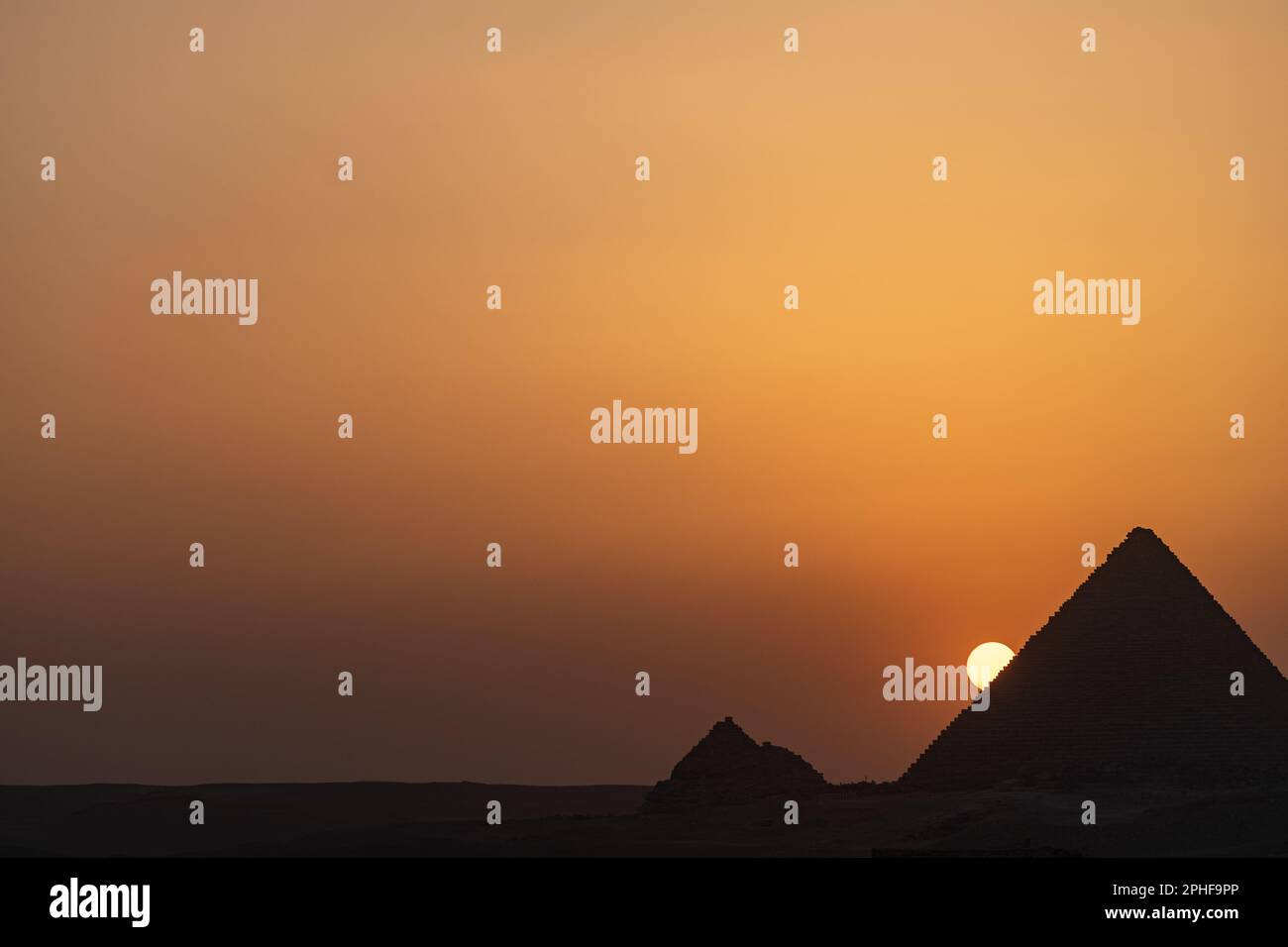 A view of the Pyramids of Giza at sunset in Egypt Stock Photo - Alamy