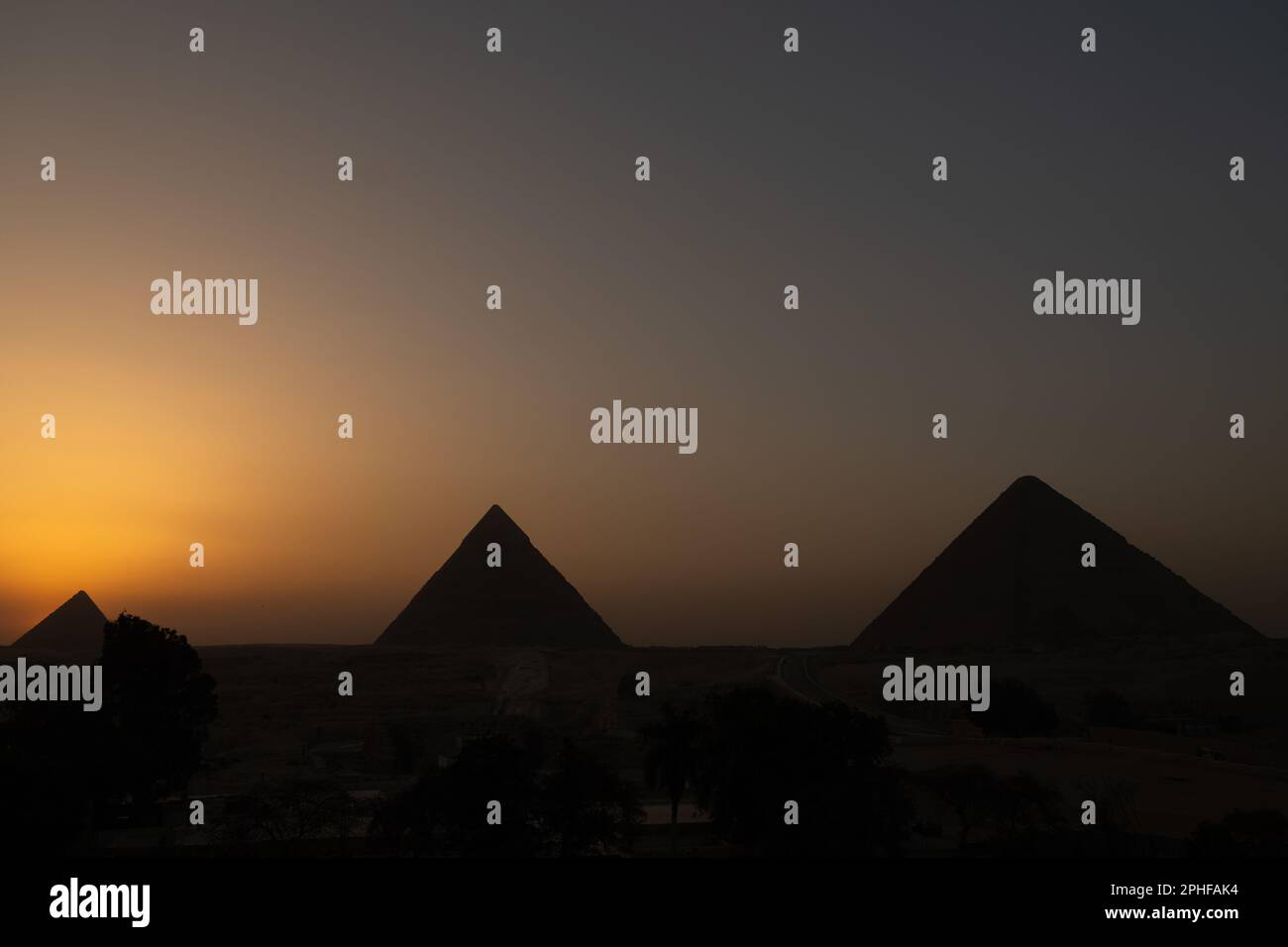 A view of the Pyramids of Giza at sunset in Egypt Stock Photo - Alamy