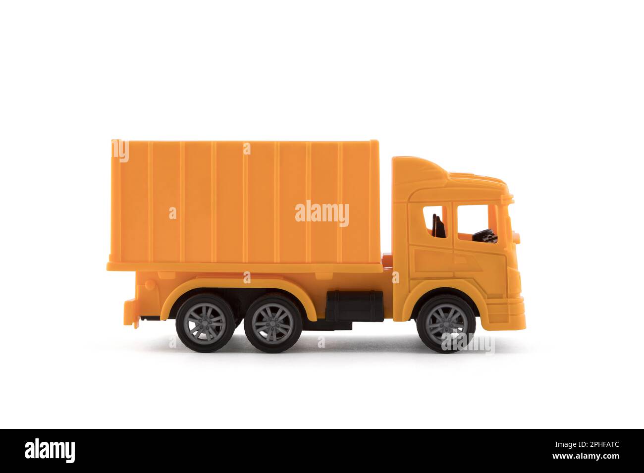 Yellow cargo delivery truck miniature isolated on white background with ...