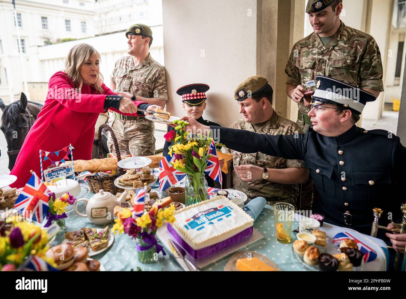 Presenter Mel Geidroyc with members of the Scots Guards and Coldstream ...