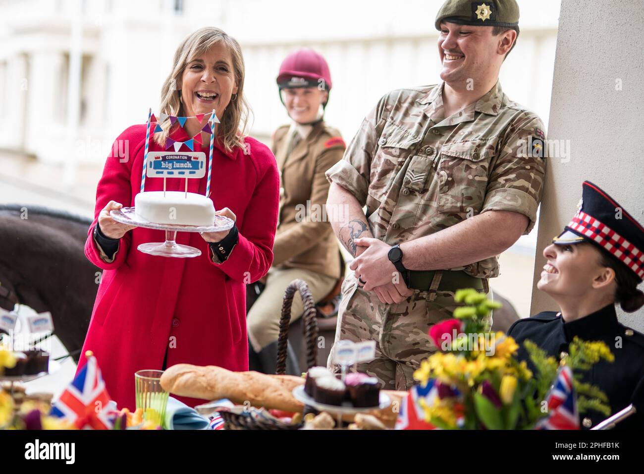 Presenter Mel Geidroyc with members of the Scots Guards and Coldstream ...