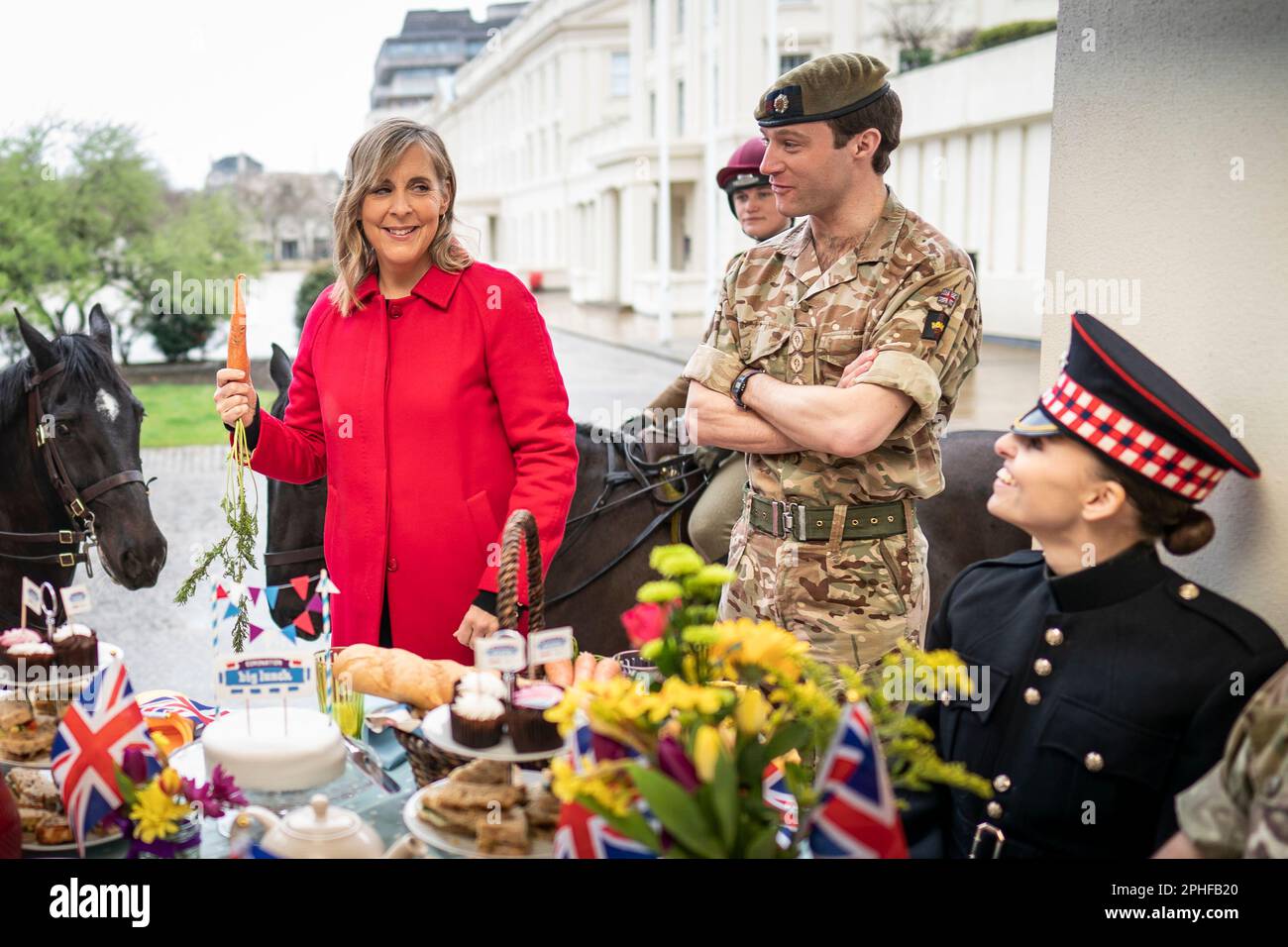 Presenter Mel Geidroyc with members of the Scots Guards and Coldstream ...