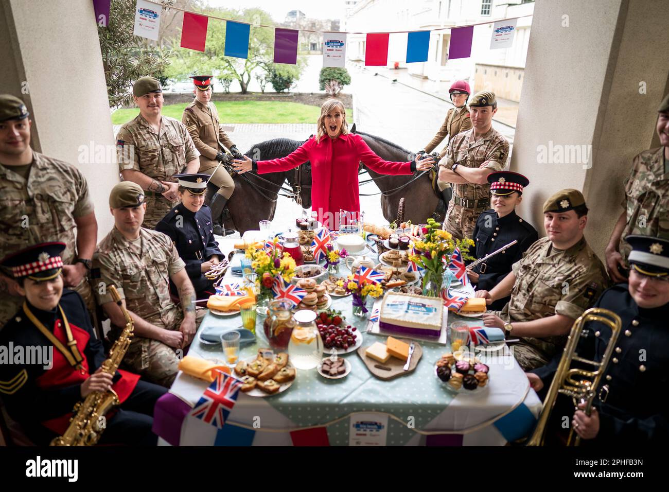 Presenter Mel Geidroyc with members of the Scots Guards and Coldstream ...