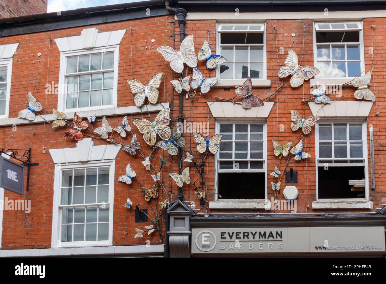 A mural of butterflies on buildings in Sadler Gate, Derby Stock Photo ...