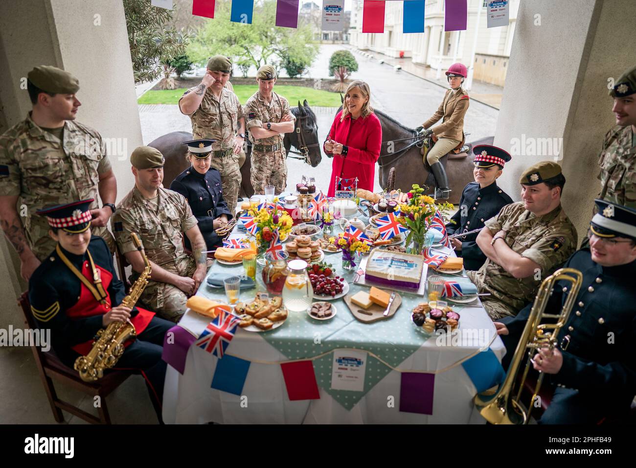 Presenter Mel Geidroyc with members of the Scots Guards and Coldstream ...