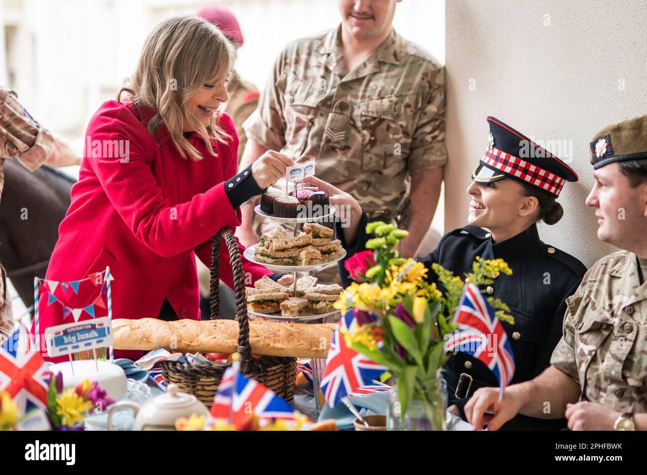 Presenter Mel Geidroyc with members of the Scots Guards and Coldstream ...