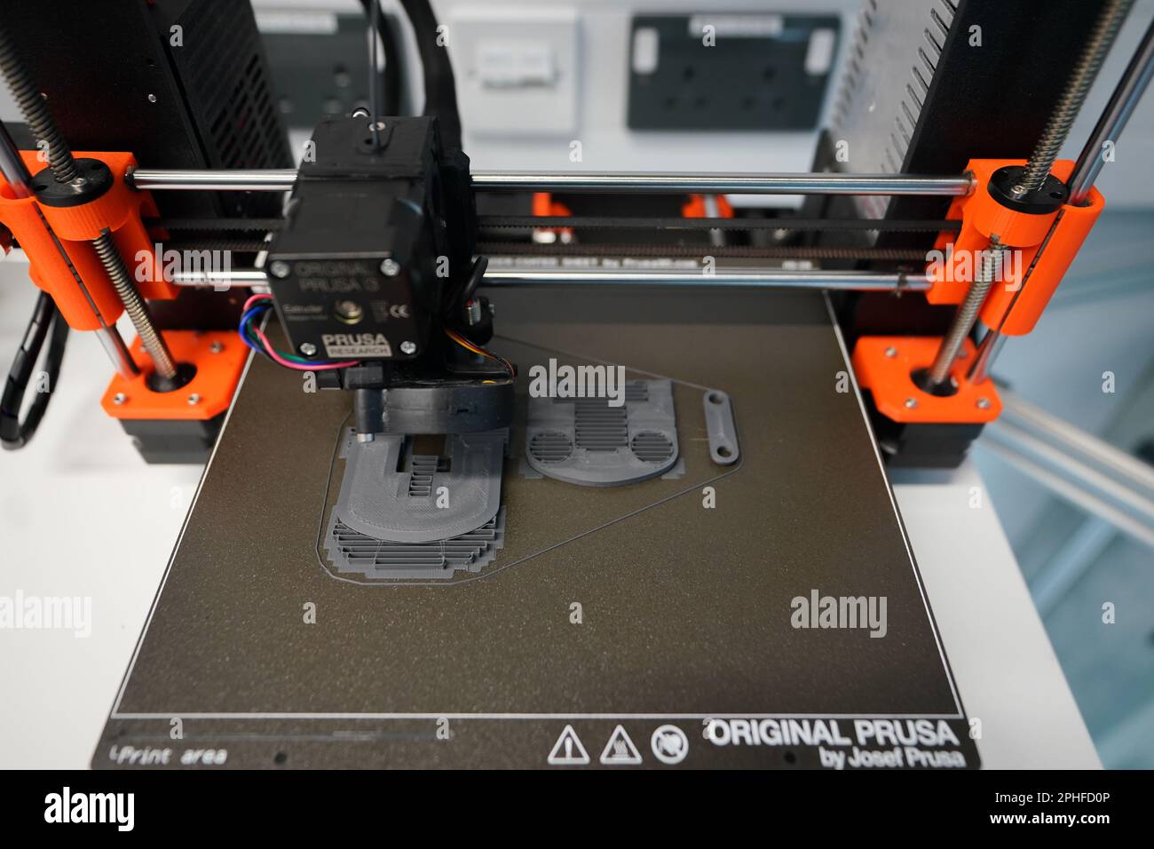 A 3D printer which makes parts for a prosthetic limb on display during ...