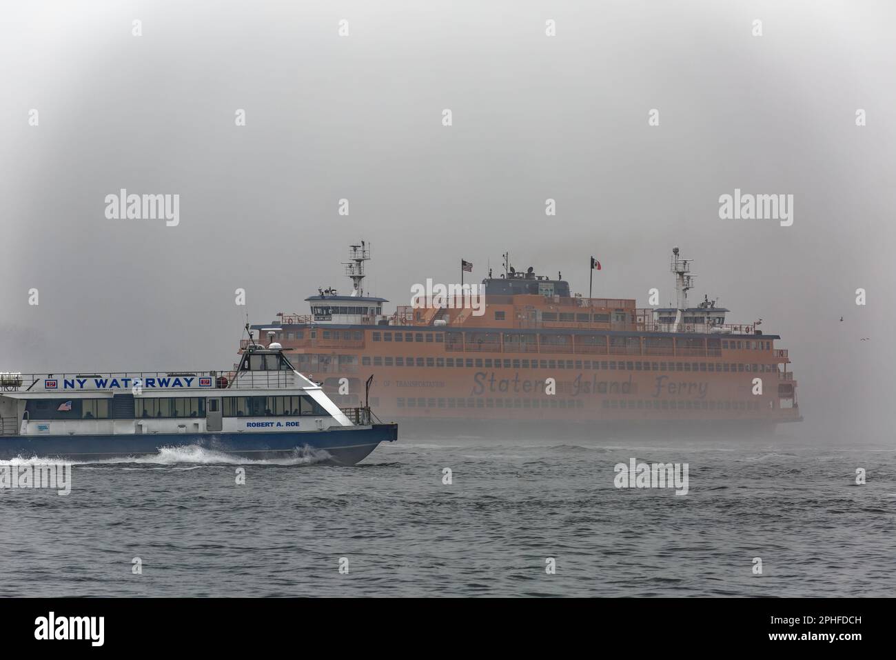 The bright orange Staten Island Ferry John J. Marchi dwarfs other ...