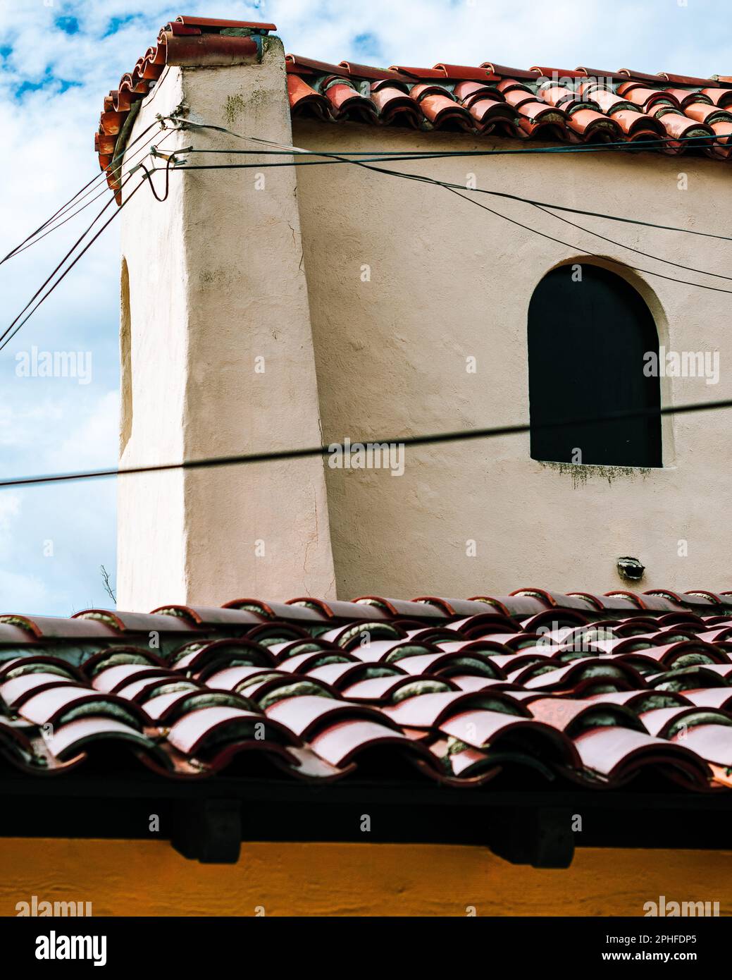 A red clay tiled roof of a residential property situated in a suburban ...