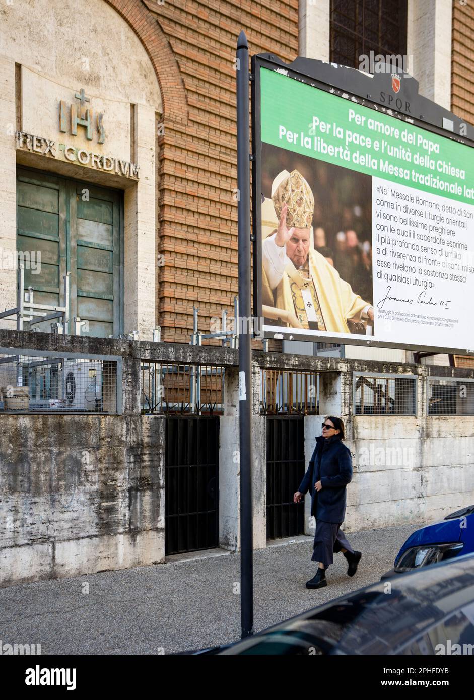 A poster with a photograph of late pope St. John Paul II and reading in ...