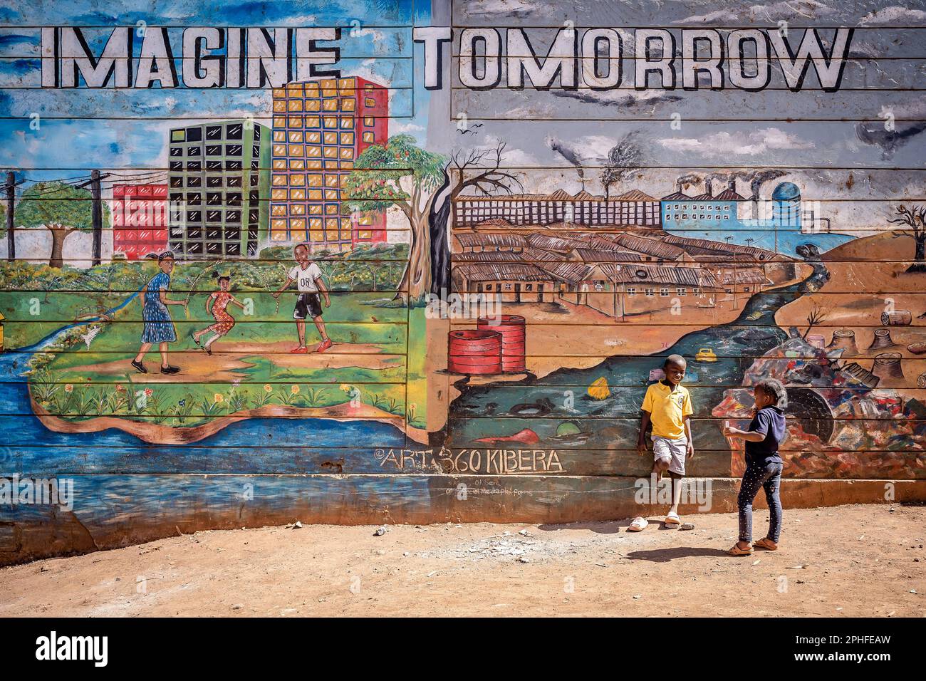 Children stand in front of a mural in Kibera slum, Nairobi, Kenya ...