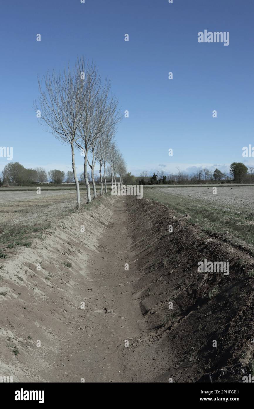 Dry irrigation ditches in the fields Stock Photo - Alamy