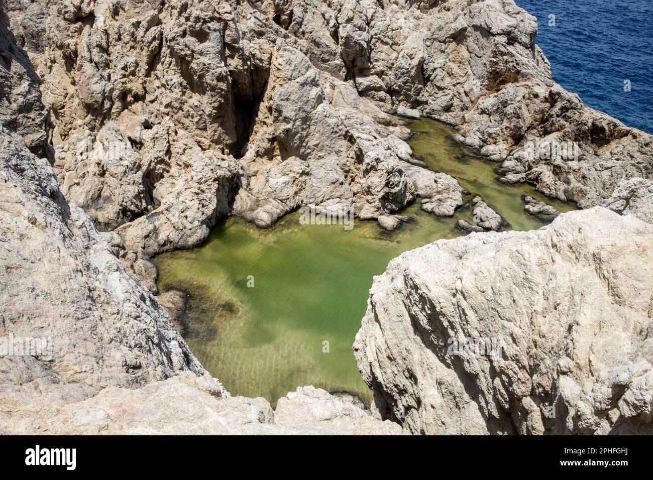 A beautiful seascape of an ocean shoreline featuring a body of water on ...