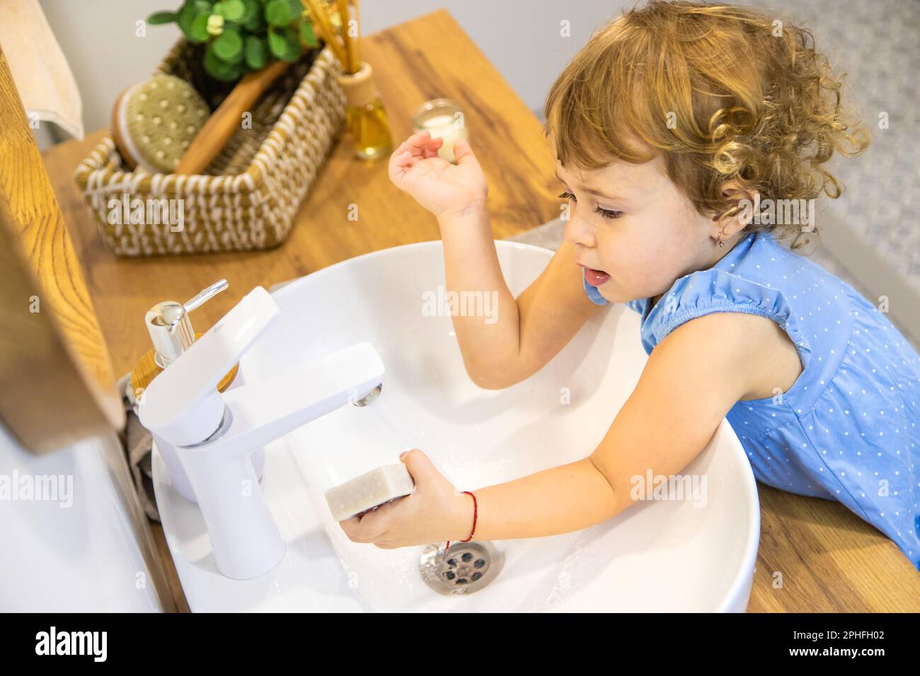 The child washes his hands with soap. Selective focus. Kid Stock Photo ...