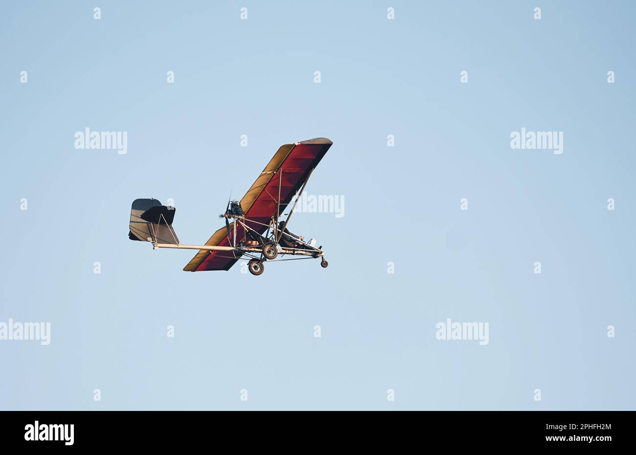Plane flying high up in the cloudless sky at daytime. Male pilot Stock ...