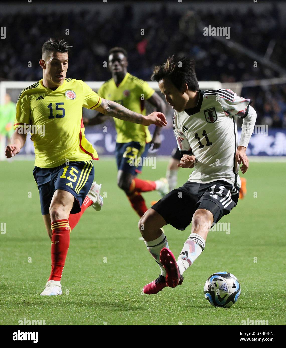 Colombia's Mateus URIBE (L) and Japan's Takefusa Kubo struggle to hold ...
