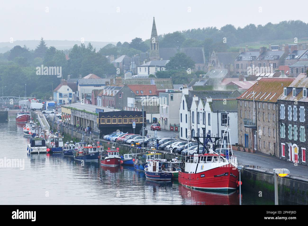 Eyemouth fishing harbour on the Berwickshire Coast showing a mixture of ...