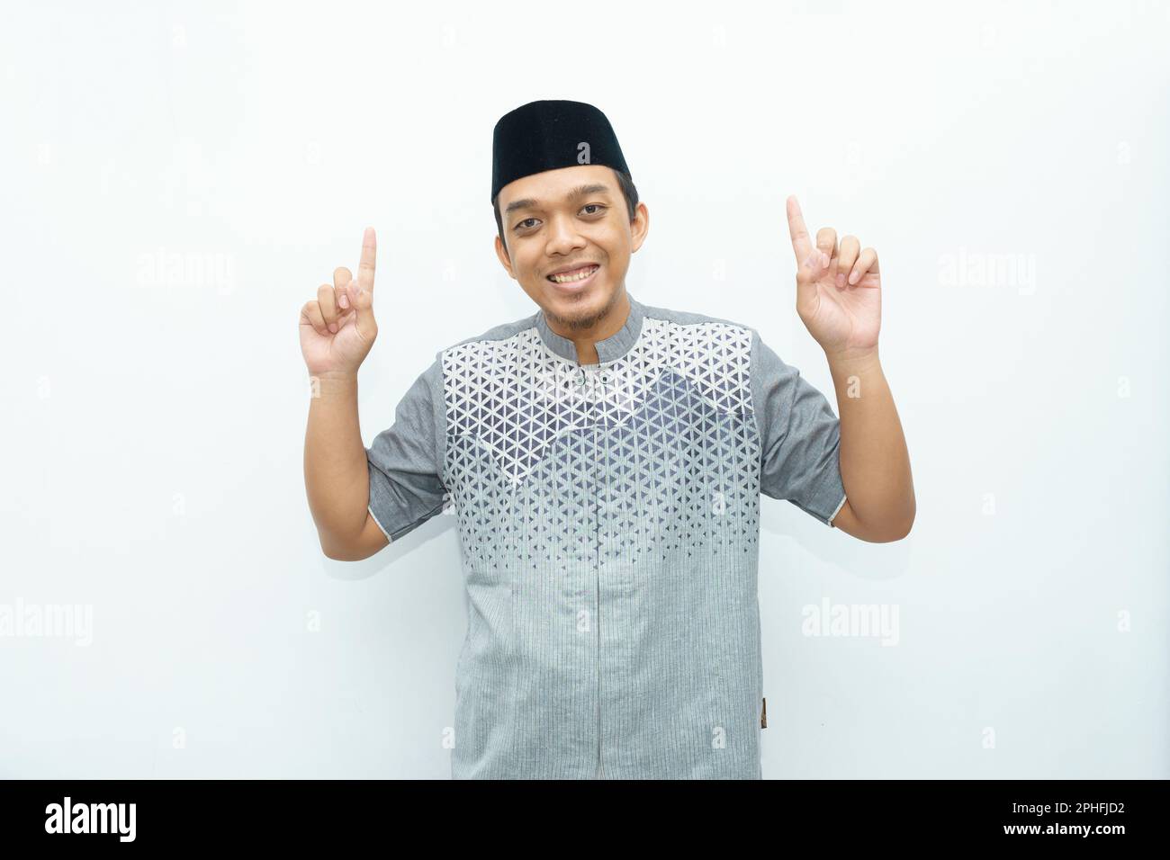 Portrait of Indonesian Asian Muslim man showing fingers up Stock Photo ...