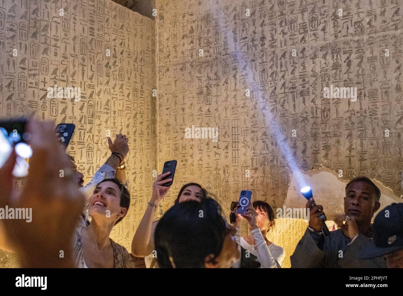 People / Tourists taking photos of the hieroglyphics in an underground ...