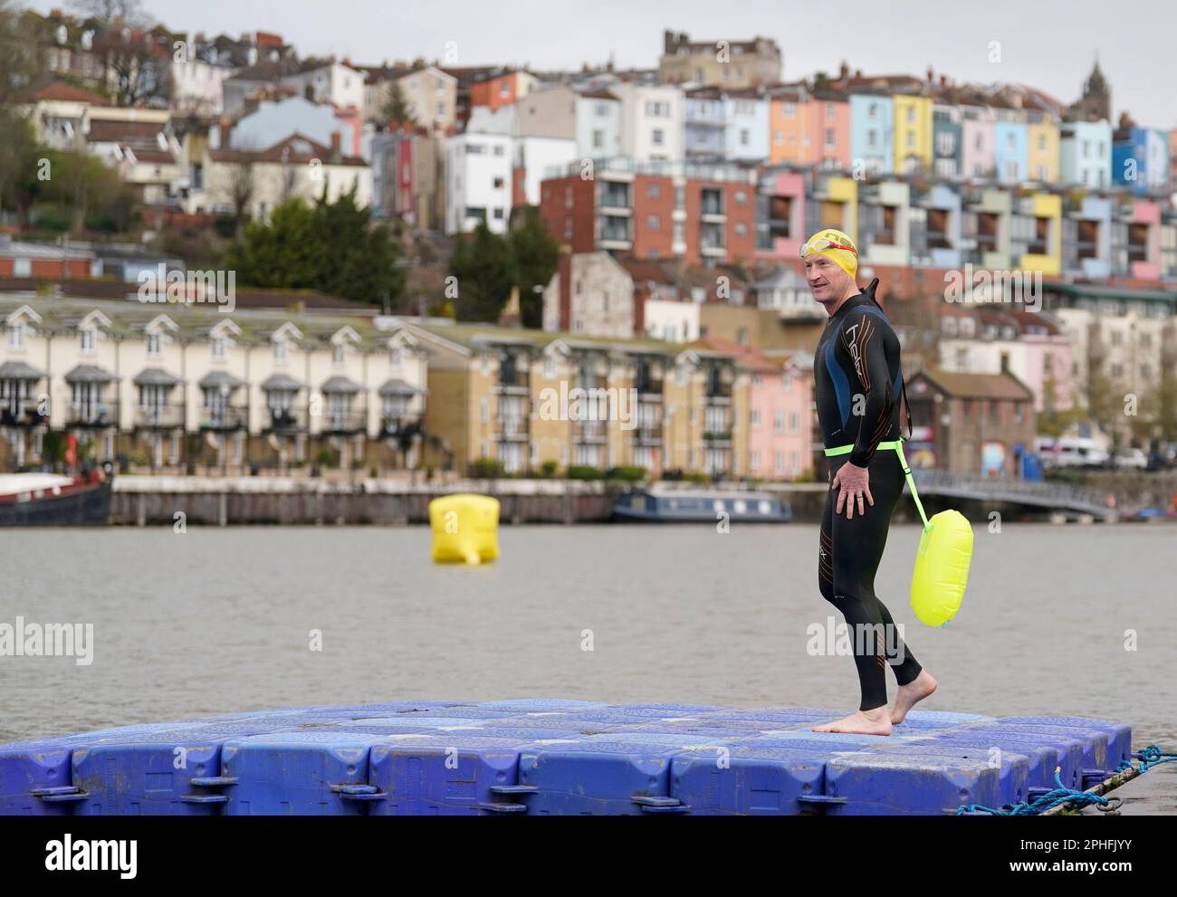 Swimmer David Quartermain walks into the water before taking part in ...
