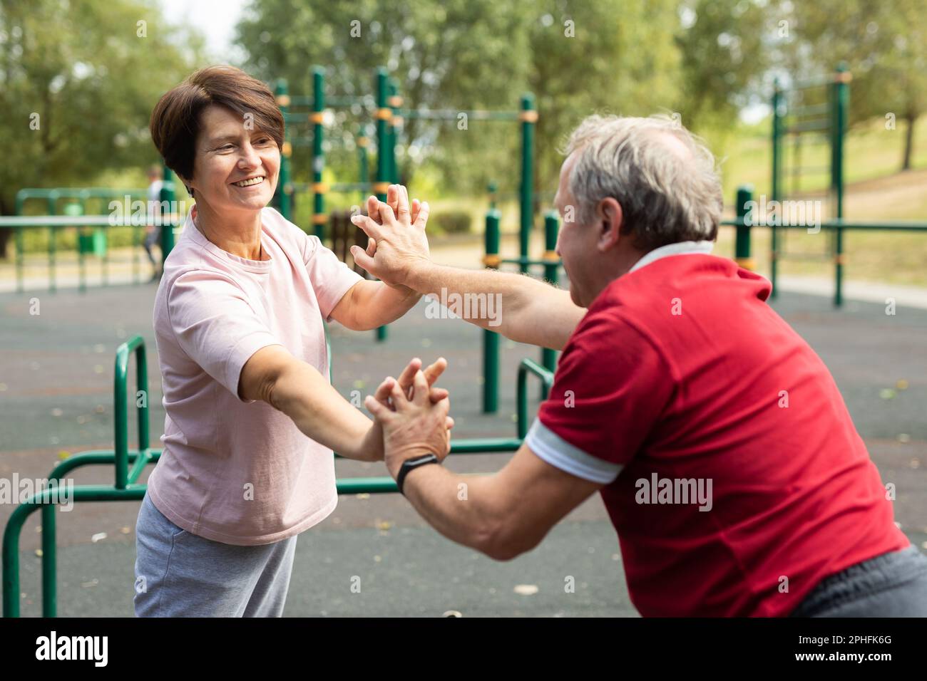 Concept of healthy lifestyle for elderly. Married couple raise each ...