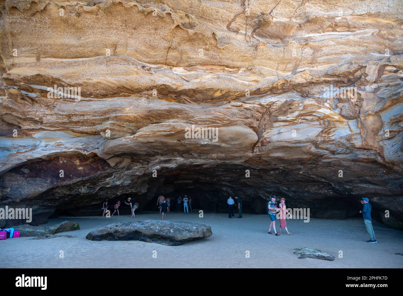 The rock formations tower above tourists and sightseers as they explore ...