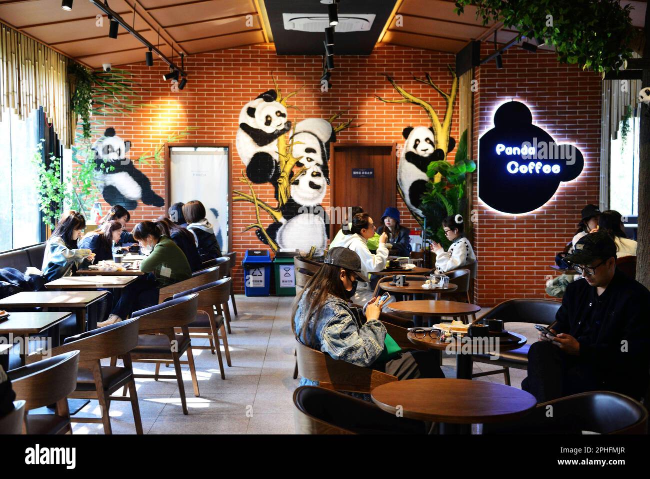 People have food and drinks in a panda-theme cafe in Beijing Zoo in ...