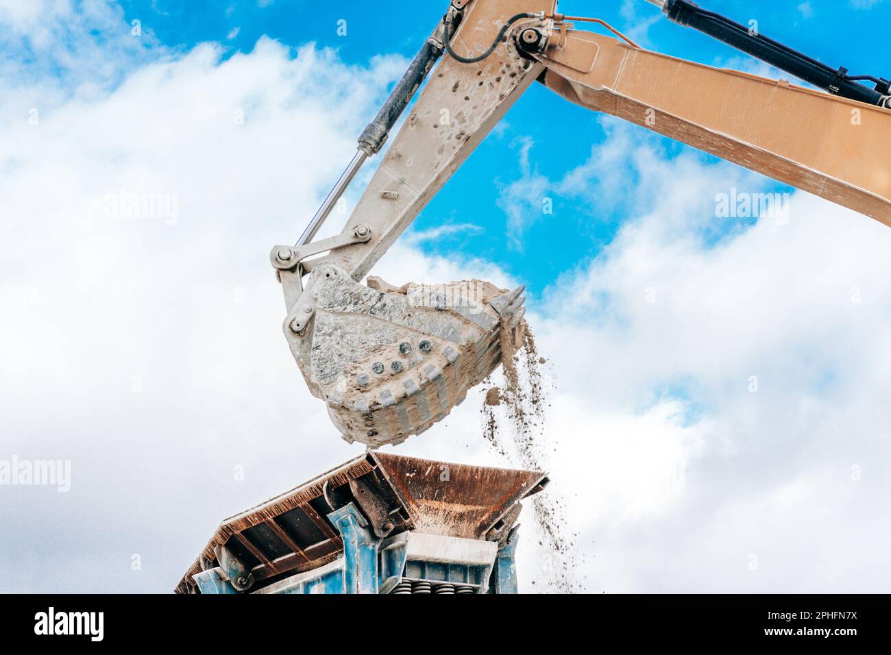 Wheel loader, large bucket with limestone. Construction. Open pit ...