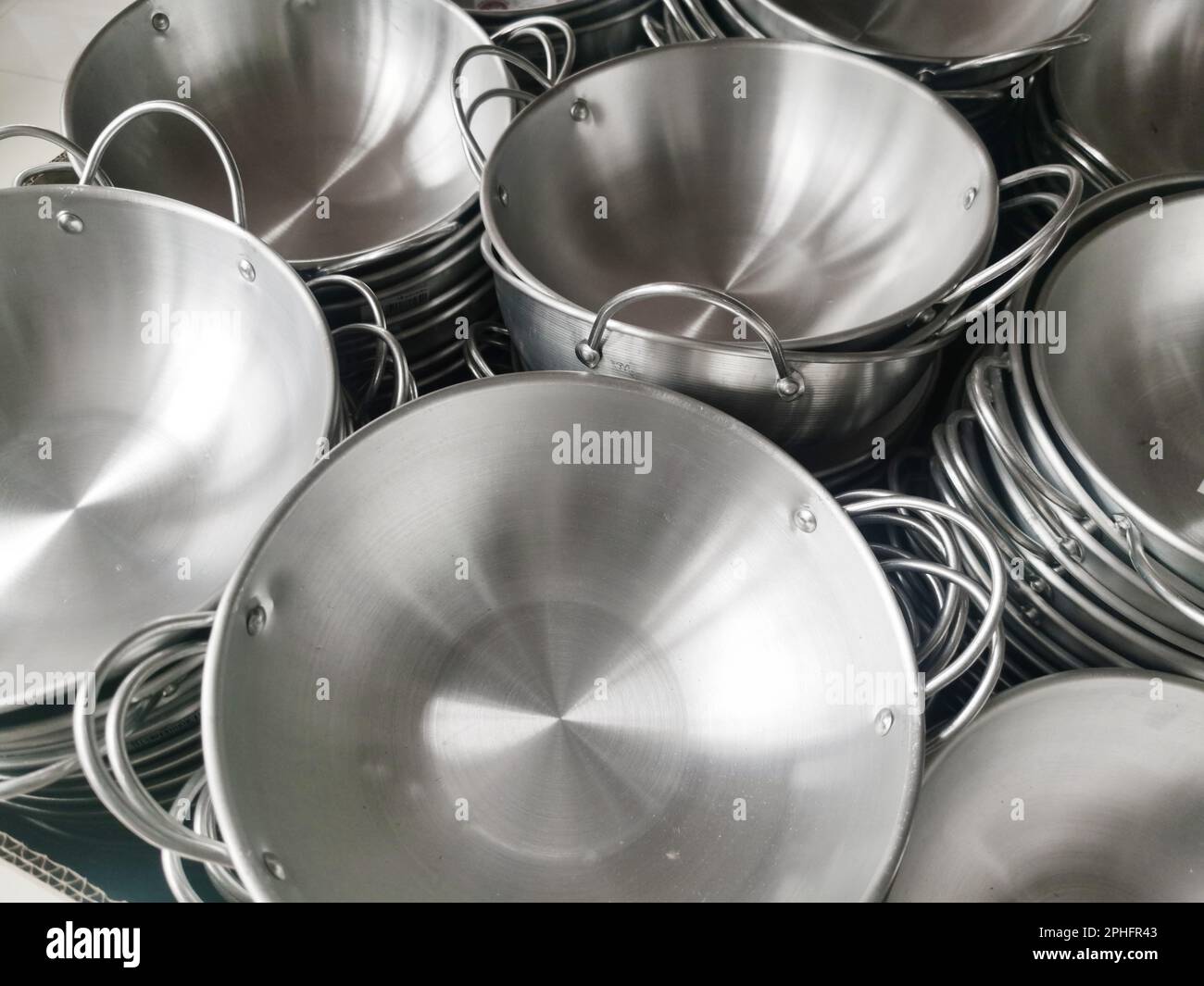Stack of metallic bowls in a shop Stock Photo - Alamy