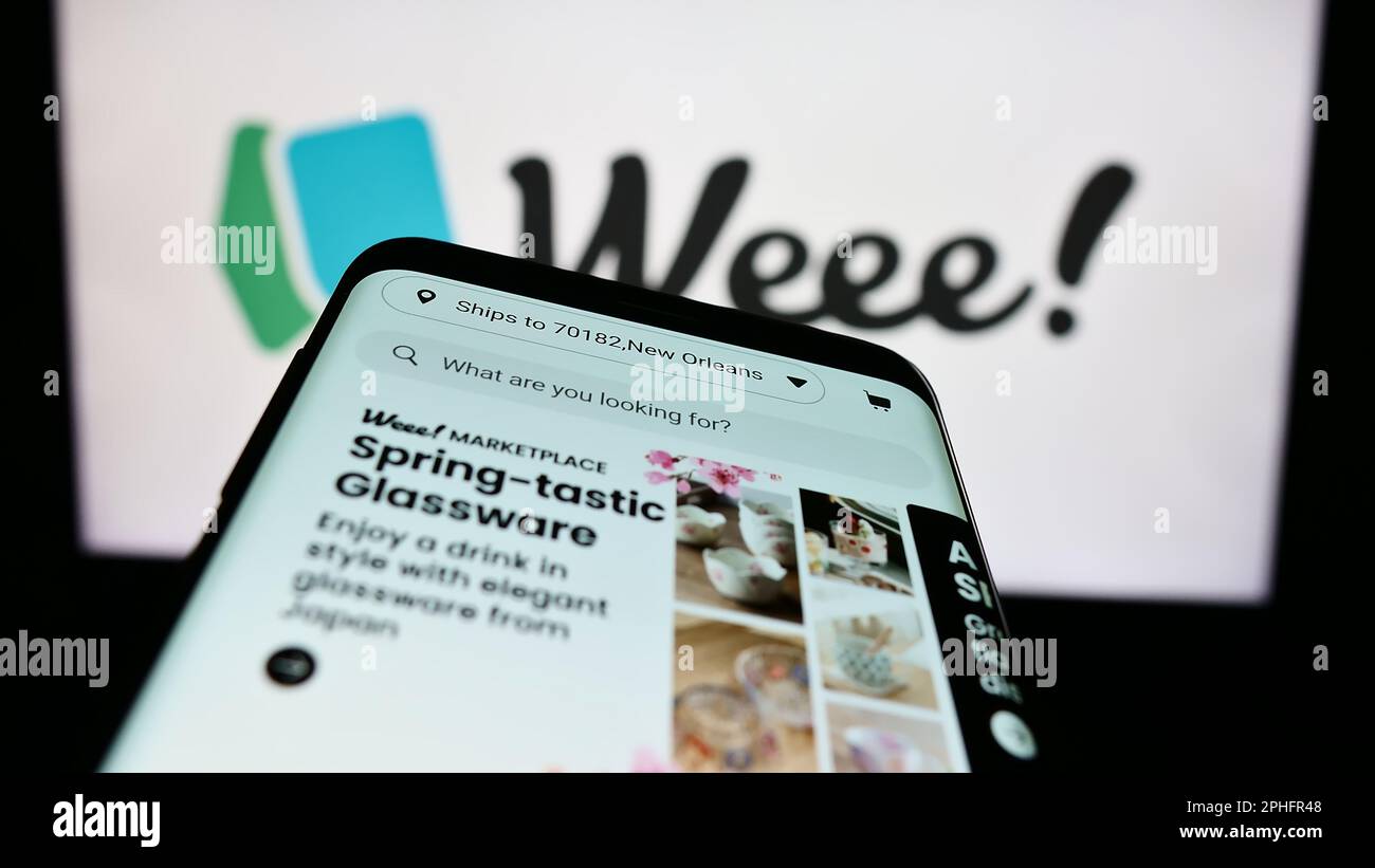 Mobile phone with webpage of US grocery delivery company Weee Inc ...