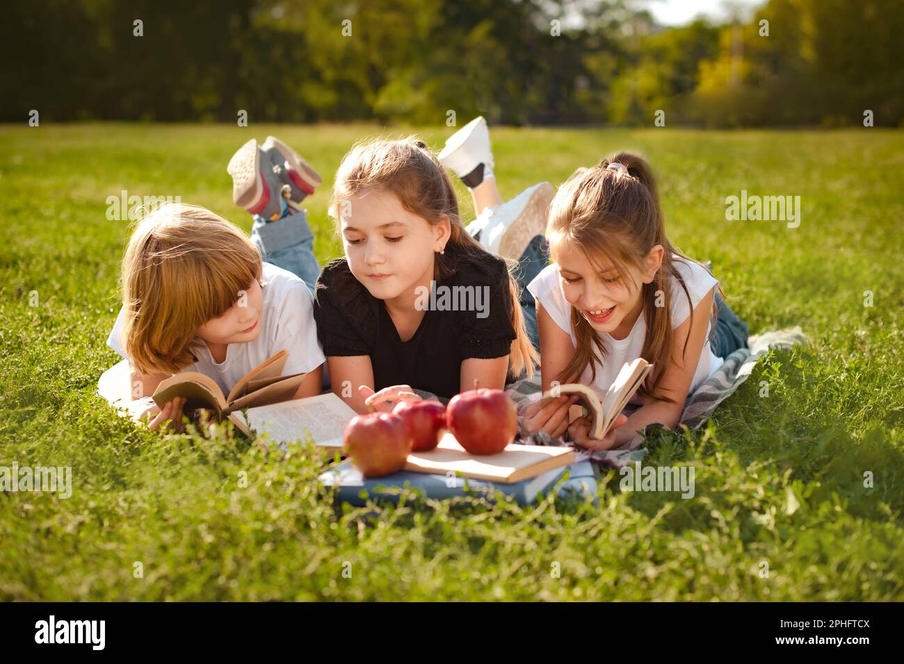Kids reading literature. Boy and girls learning or studying. Teenage ...