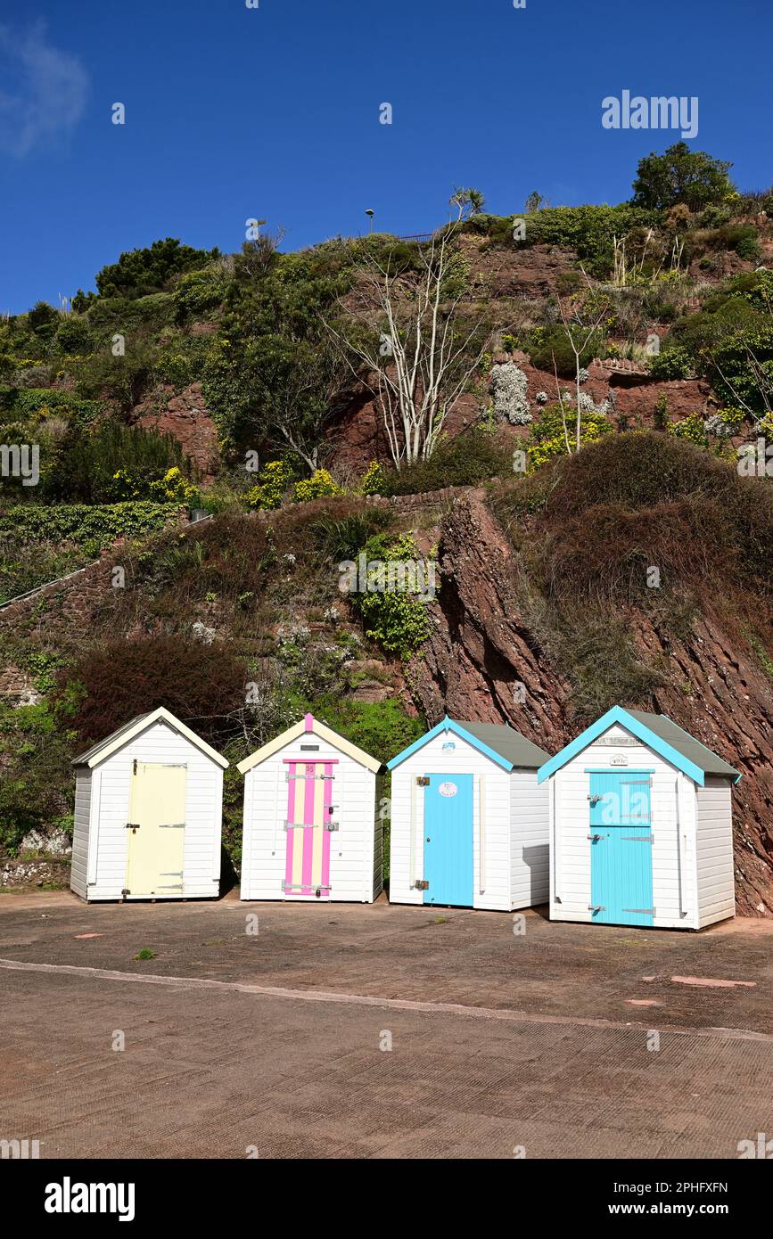Beach huts beneath Roundham Head, on the seafront at Goodrington Sands ...