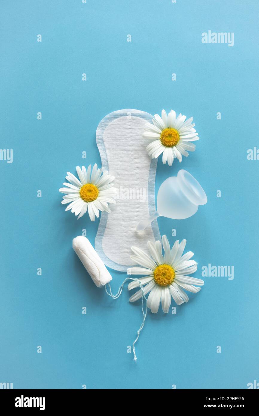 Hygienic white female pad, Menstrual cup and tampon with chamomile ...
